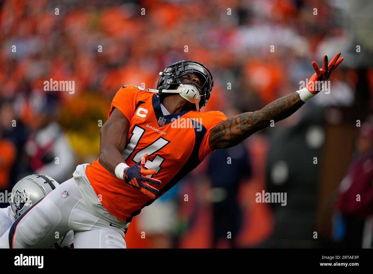 Denver Broncos wide receiver Courtland Sutton (14) reaches for a pass ...