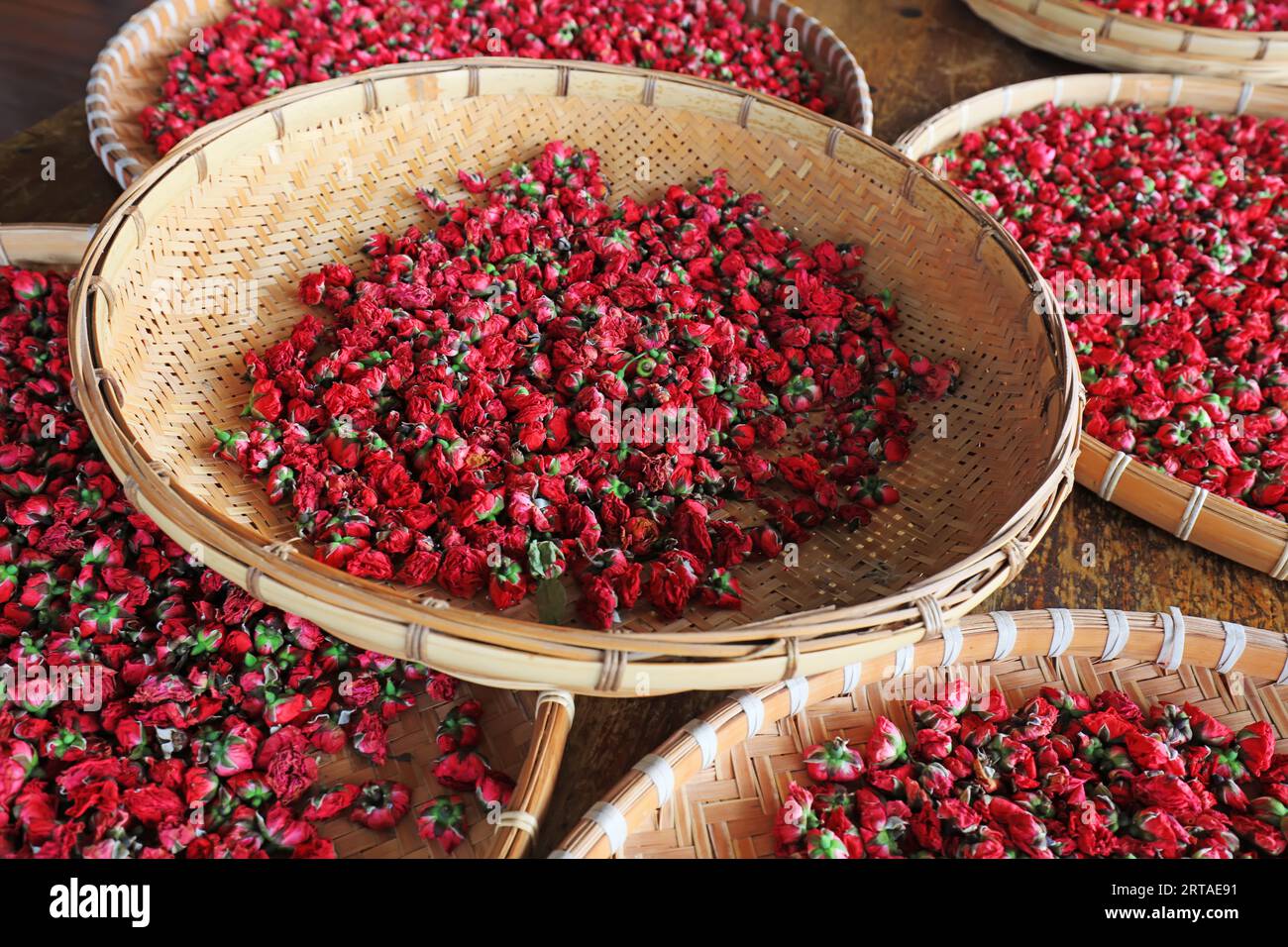 The dried roses are in the basket, in a rose processing factory, Sanya ...