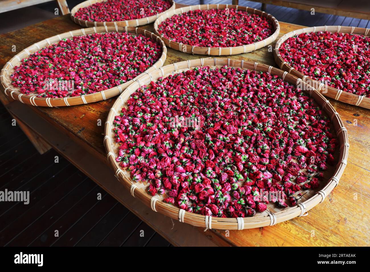 The dried roses are in the basket, in a rose processing factory, Sanya ...
