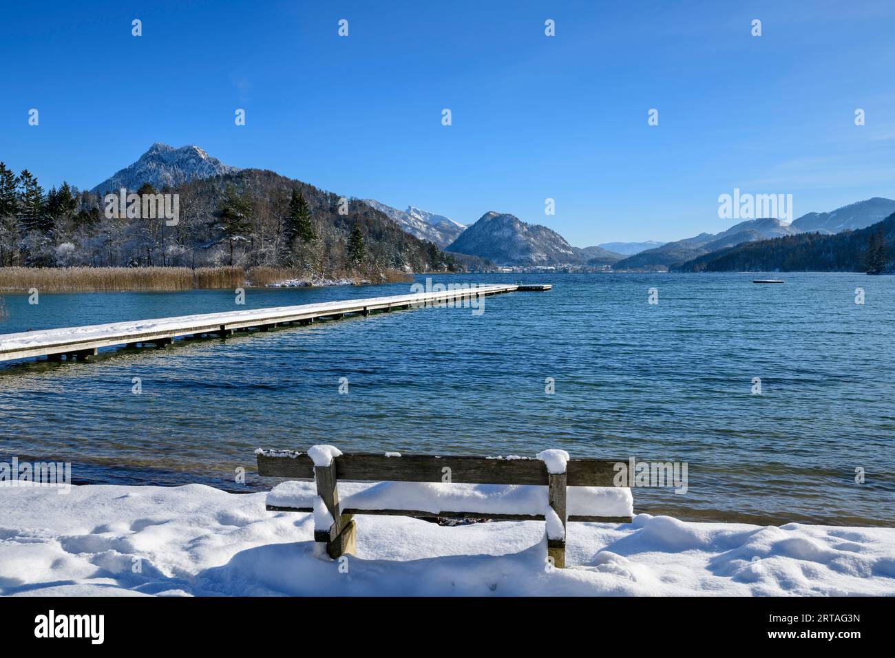 Snow covered bench at Lake Fuschl, Fuschlsee, Salzkammergut ...