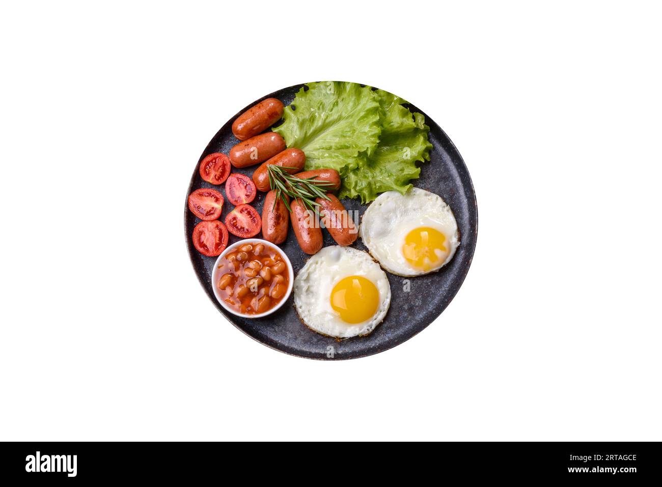 Traditional English breakfast with eggs, toast, sausages, beans, spices ...