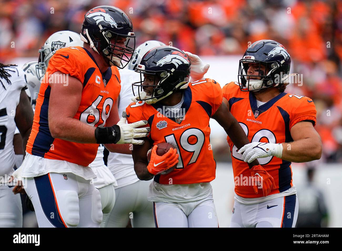 Denver Broncos wide receiver Marvin Mims Jr. (19) is congratulated by ...