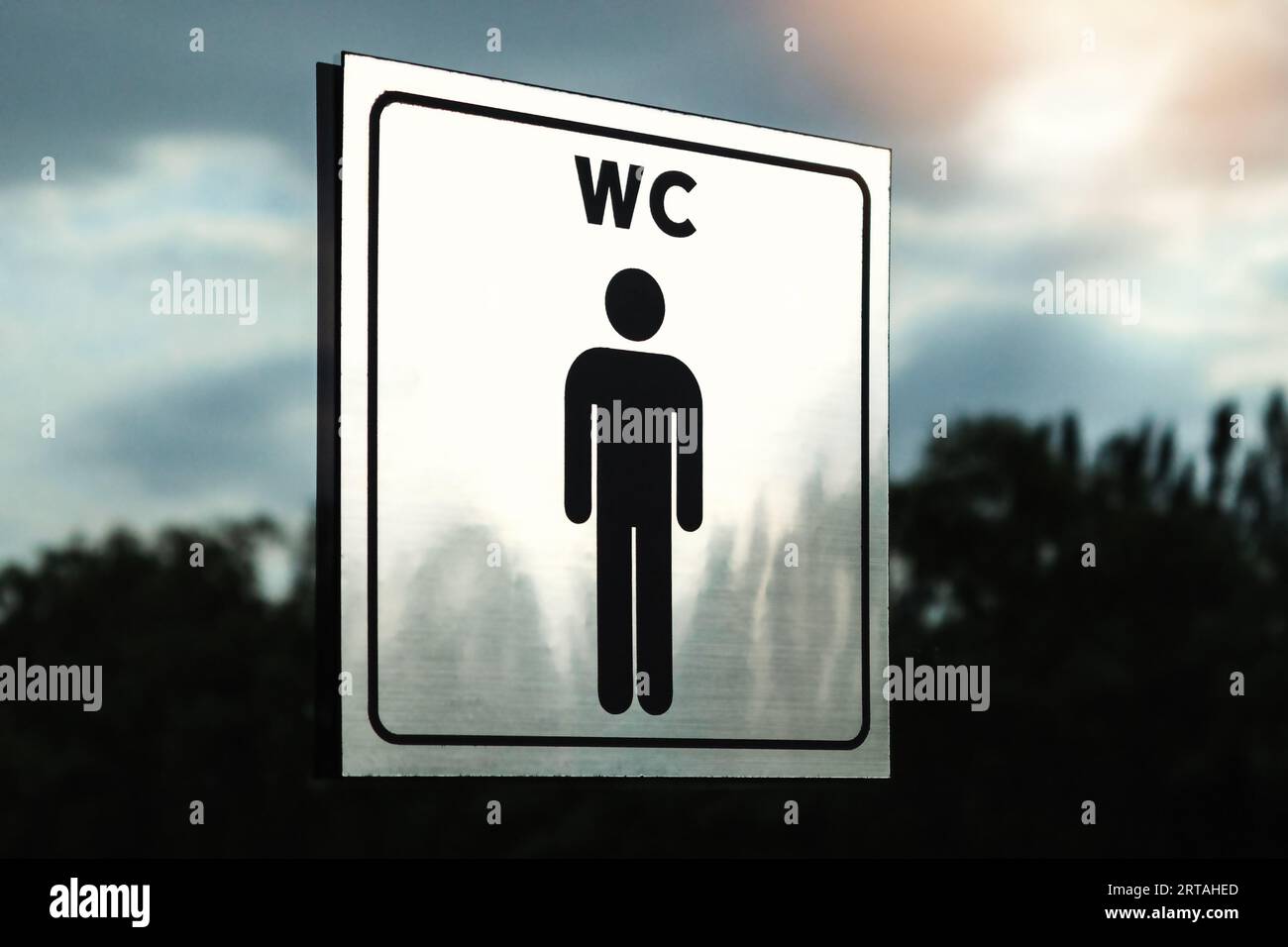 Restroom WC sign on a glass toilet door, outdoor Stock Photo - Alamy