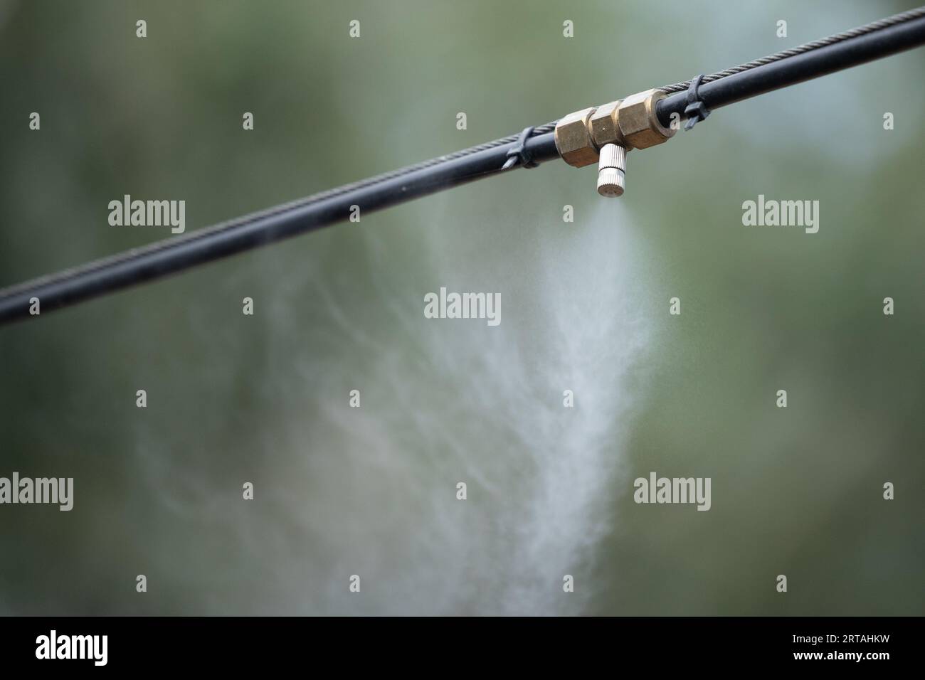 Sprinkler head from a high pressure outdoor cooling system, close-up ...