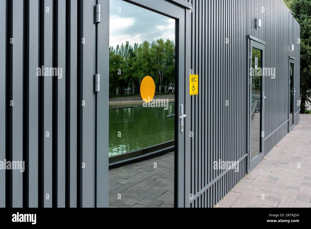 Public outdoor toilet in a park near the lake Stock Photo - Alamy