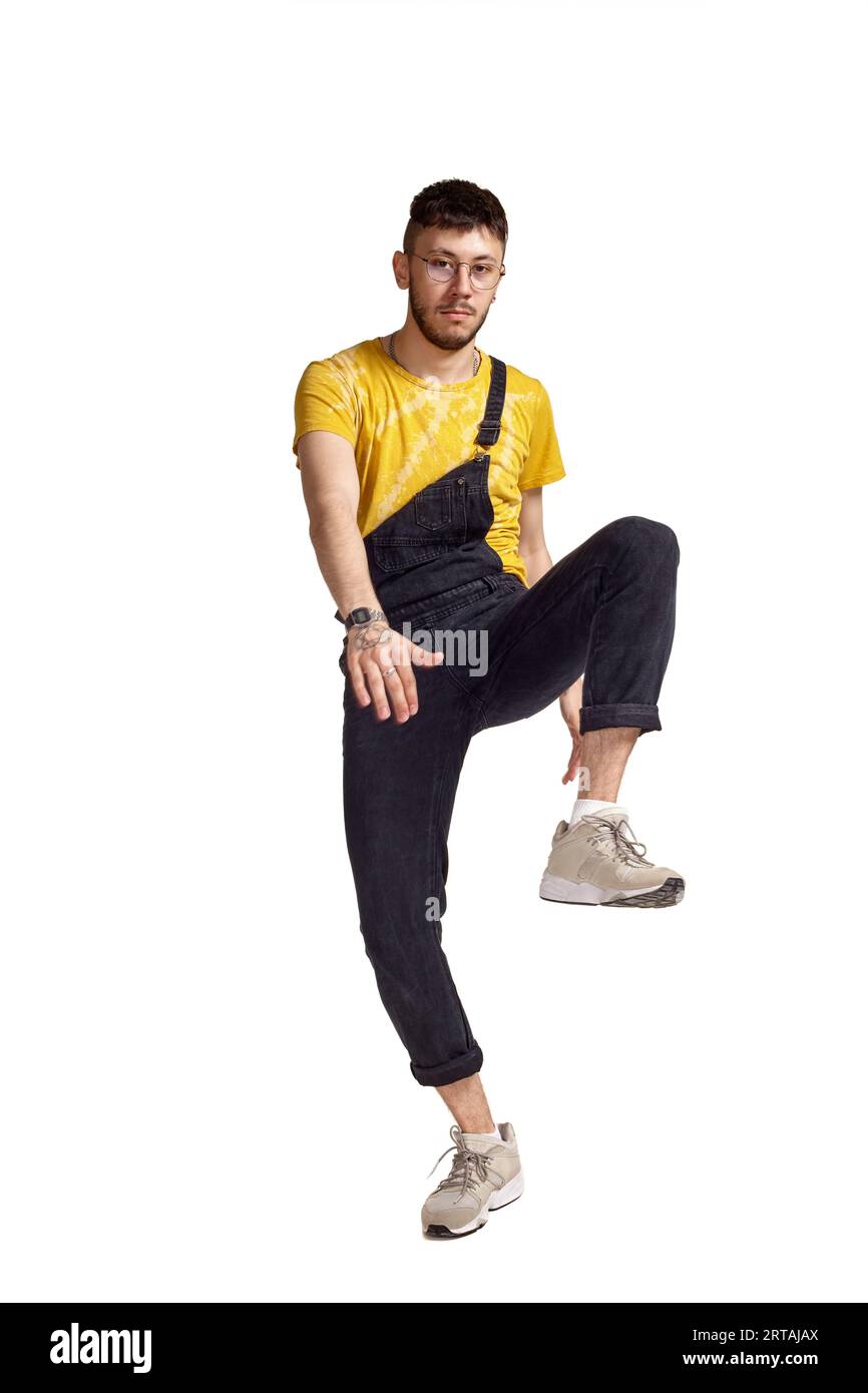 Full-length portrait of a funny guy dancing in studio isolated on white ...