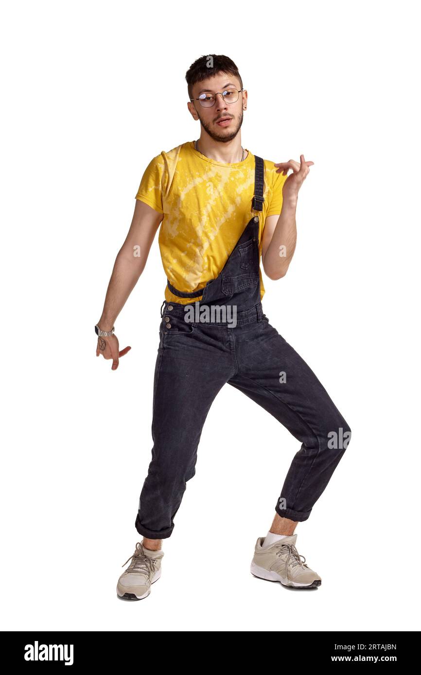Full-length portrait of a funny guy dancing in studio isolated on white ...