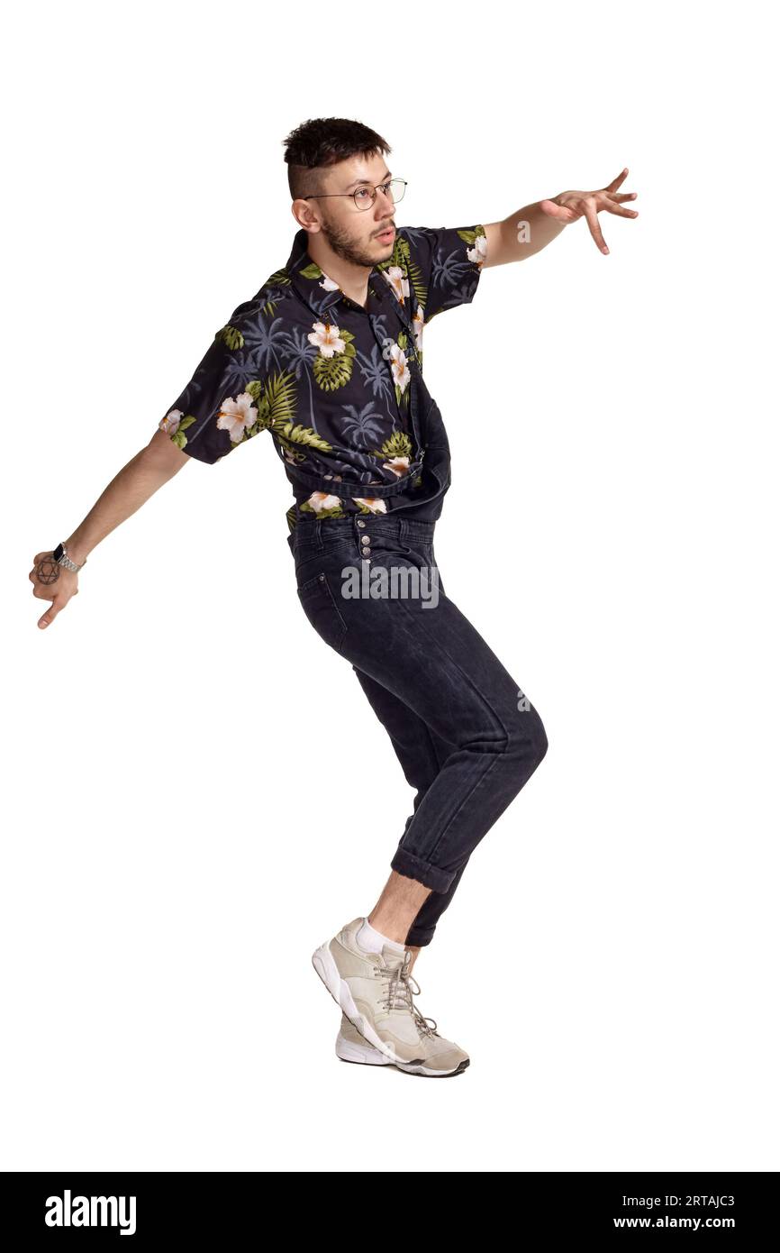 Full-length portrait of a funny guy dancing in studio isolated on white ...