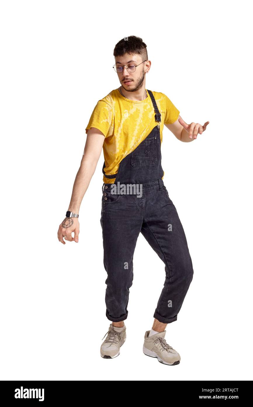 Full-length portrait of a funny guy dancing in studio isolated on white ...