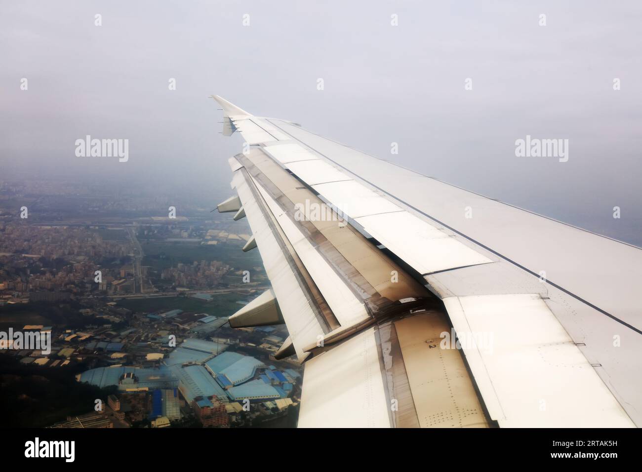 Wings of large passenger aircraft, flying at high altitude, South China ...