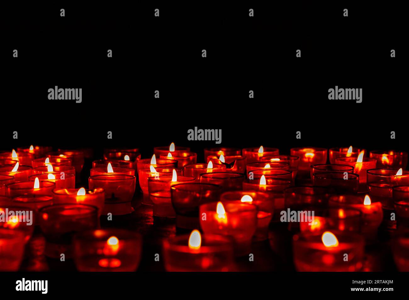red burning candles in lambadas on a dark background. Day of ...