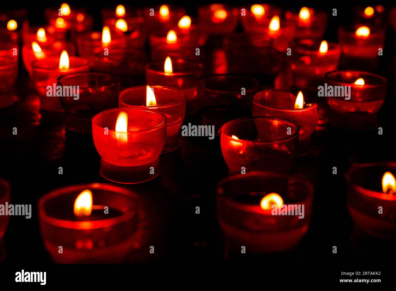 red burning candles in lambadas on a dark background. Day of ...