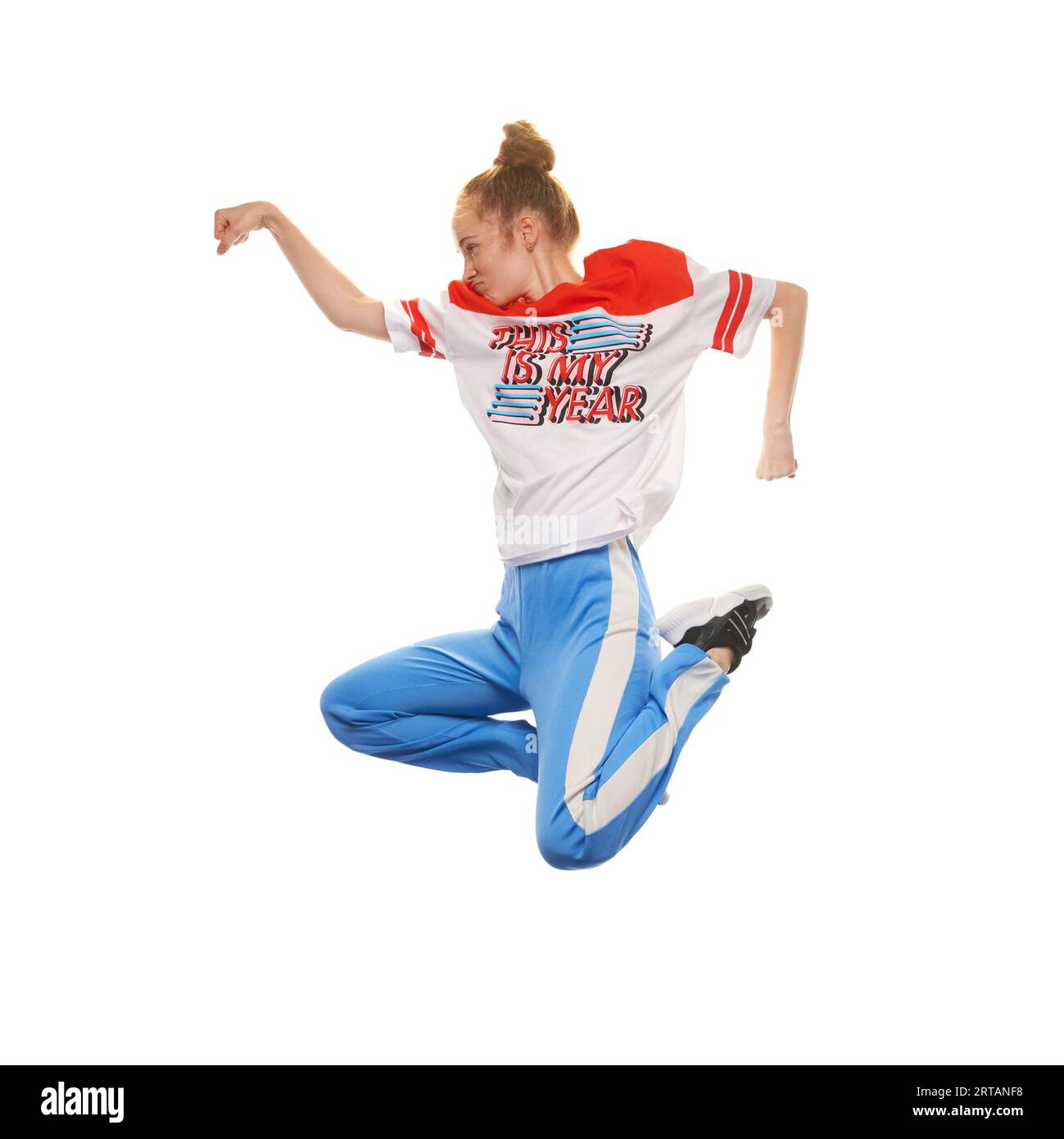 Young girl in sportswear jumping in funny meme pose isolated on white ...