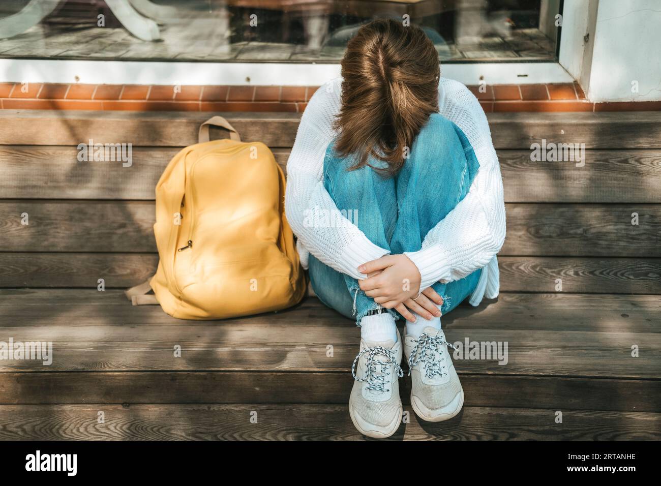 Teenage bullying hiding hi-res stock photography and images - Alamy