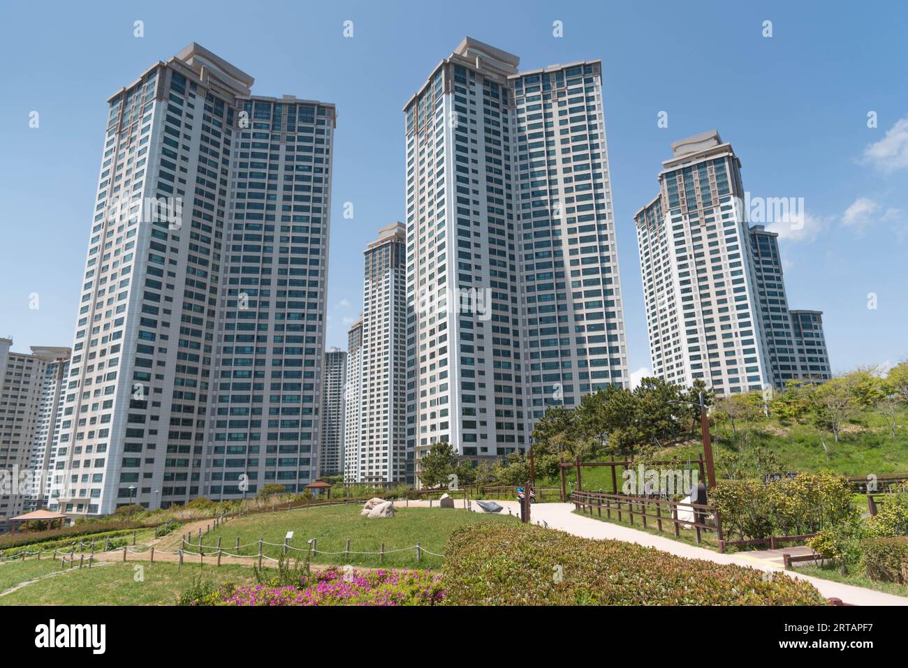 Apartment buildings with a park Stock Photo - Alamy