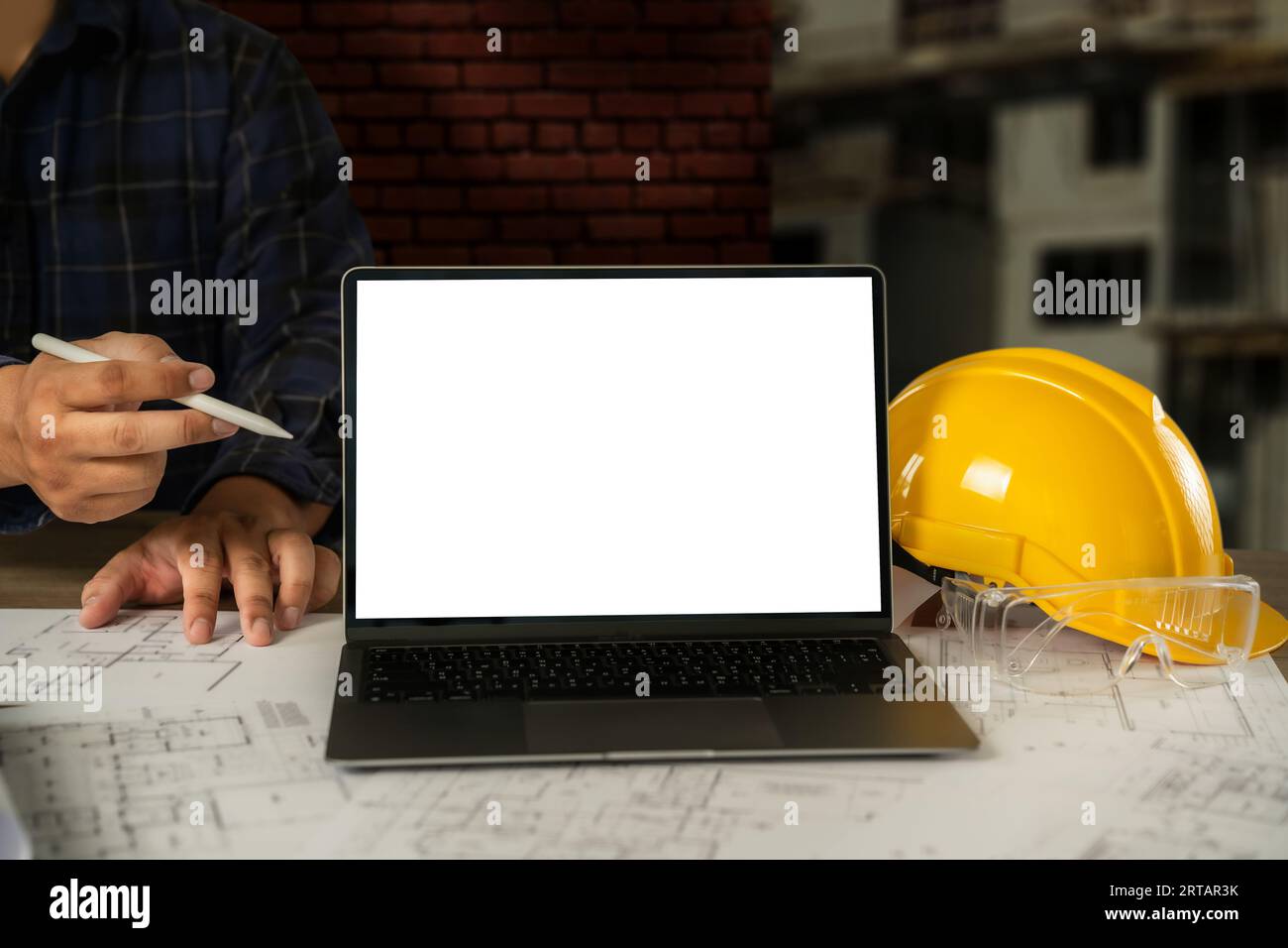 architect engineers Working on a desktop computer on a laptop mockup ...