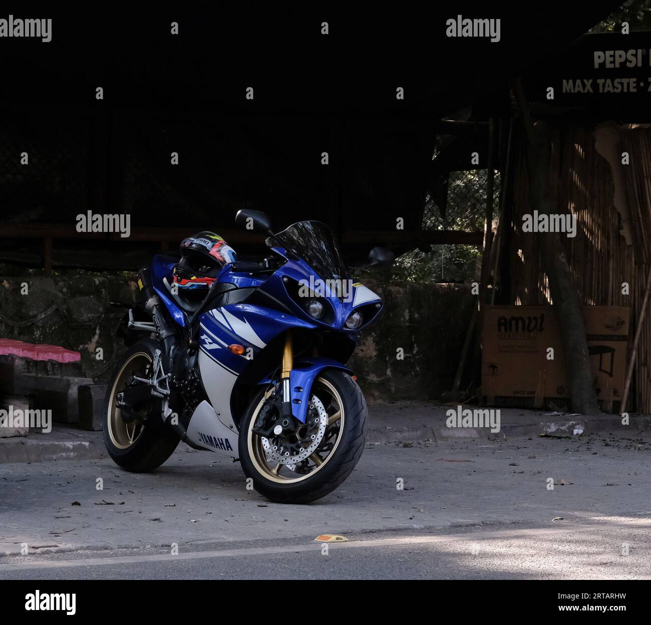 Blue and white Yamaha YZF R1 parked on the roadside under a tree Stock ...