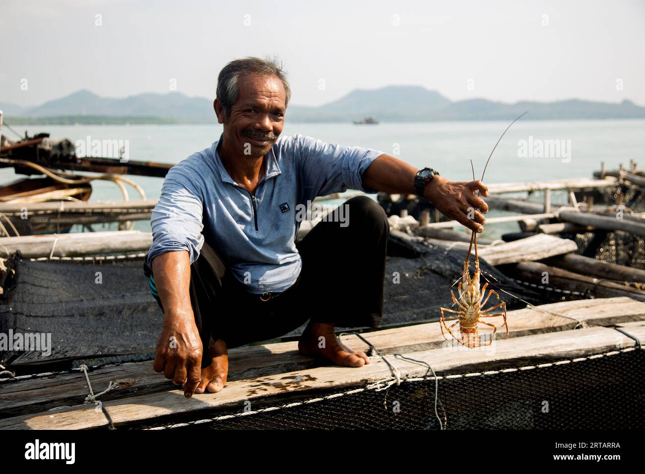 Koh Yao, Thailand; 1st January 2023: Local fisherman at a lobster farm ...