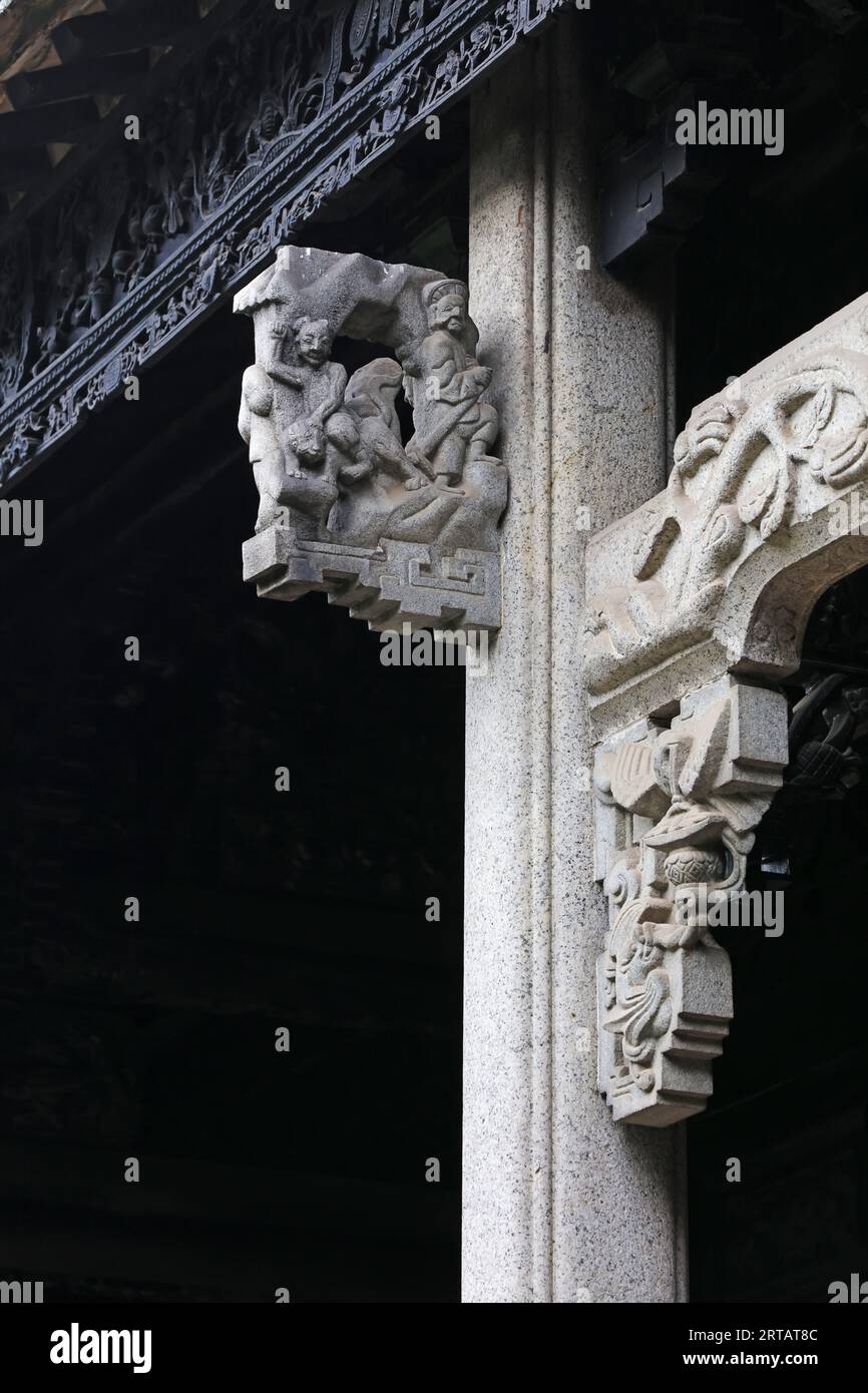 Stone carvings adorn columns in an ancestral hall in Guangzhou, China ...