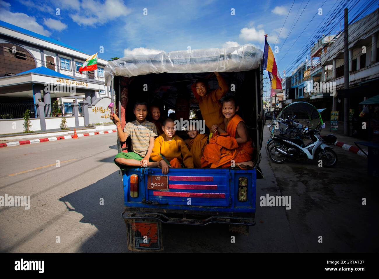 Burma, Myanmar; 1st January 2023: Young monks sitting in the back of a ...