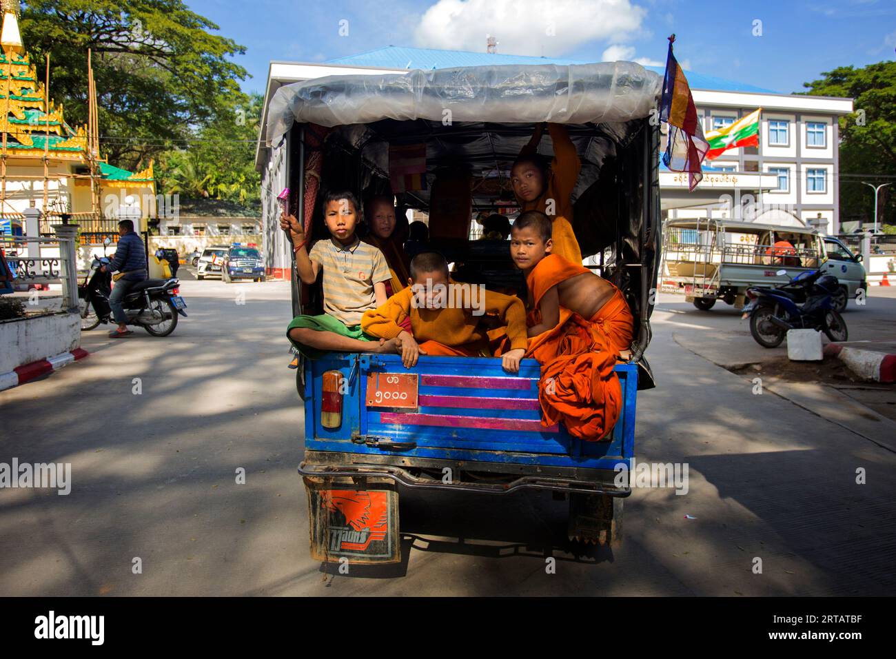 Burma, Myanmar; 1st January 2023: Young monks sitting in the back of a ...