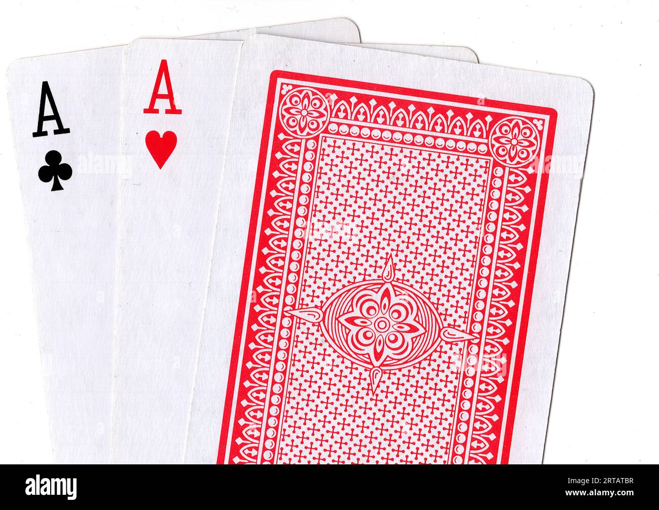 A hand of three playing cards revealing two aces on a white background ...