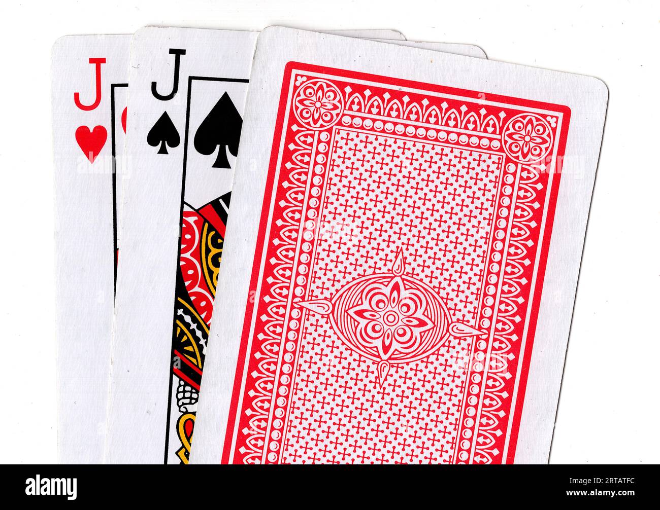 A hand of three playing cards revealing two jacks on a white background ...