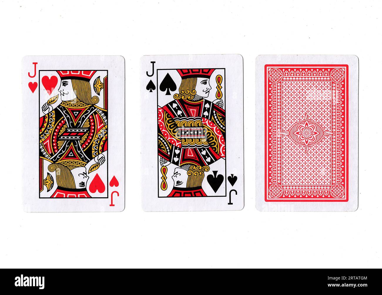 A hand of three playing cards revealing two jacks on a white background ...