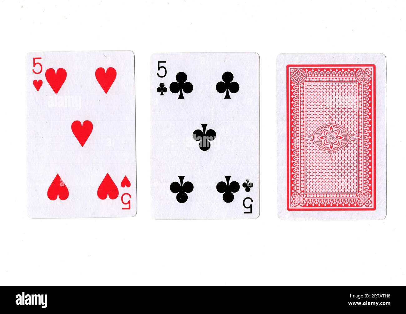 A hand of three playing cards revealing two fives on a white background ...