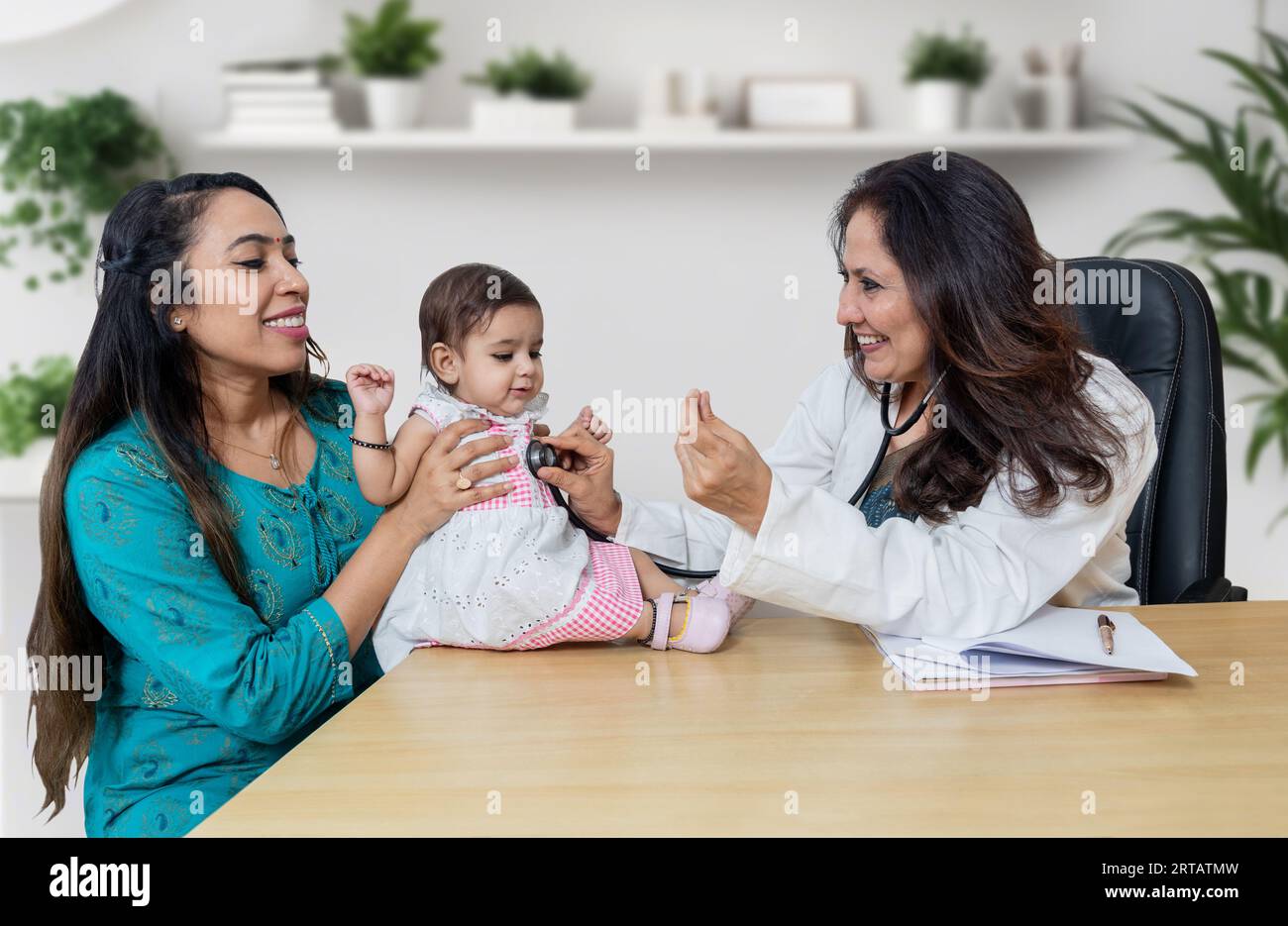Young indian mother with her cute little baby visiting general ...