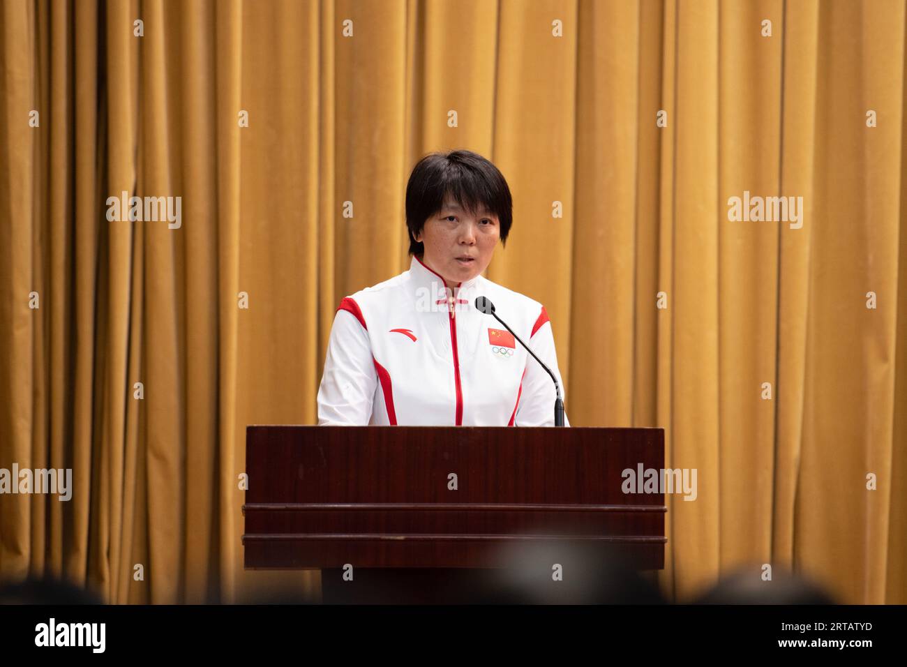 Beijing, China. 12th Sep, 2023. Huang Wenhong, representative of coaches, speaks during the ...