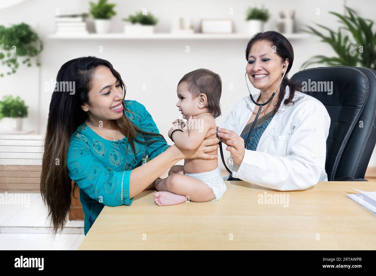 Young indian mother with her cute little baby visiting general ...