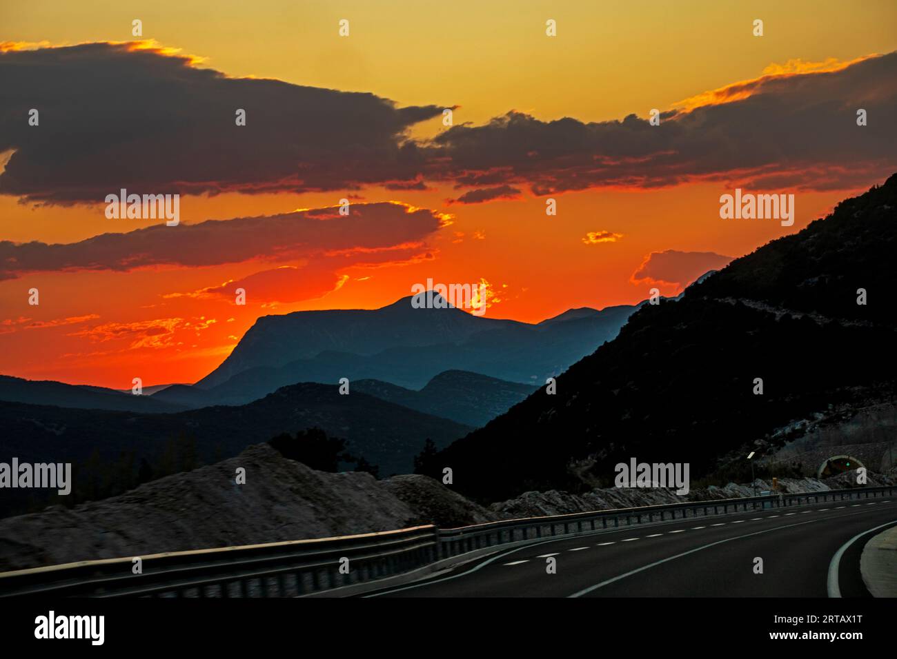 sunset on the mountain road autobahn. Journey Stock Photo - Alamy