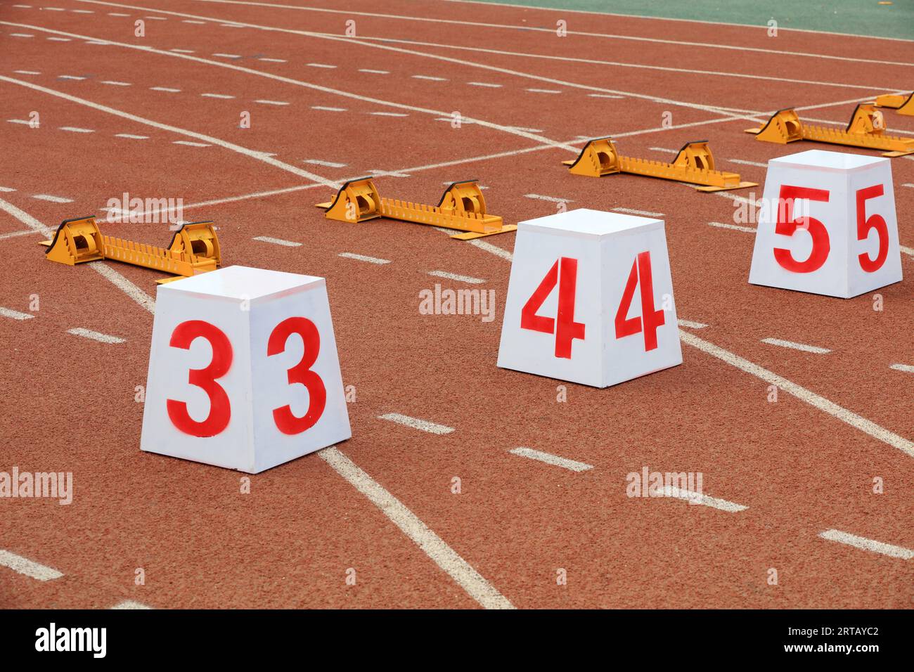 Track numbers and starters on the plastic track on the playground Stock ...