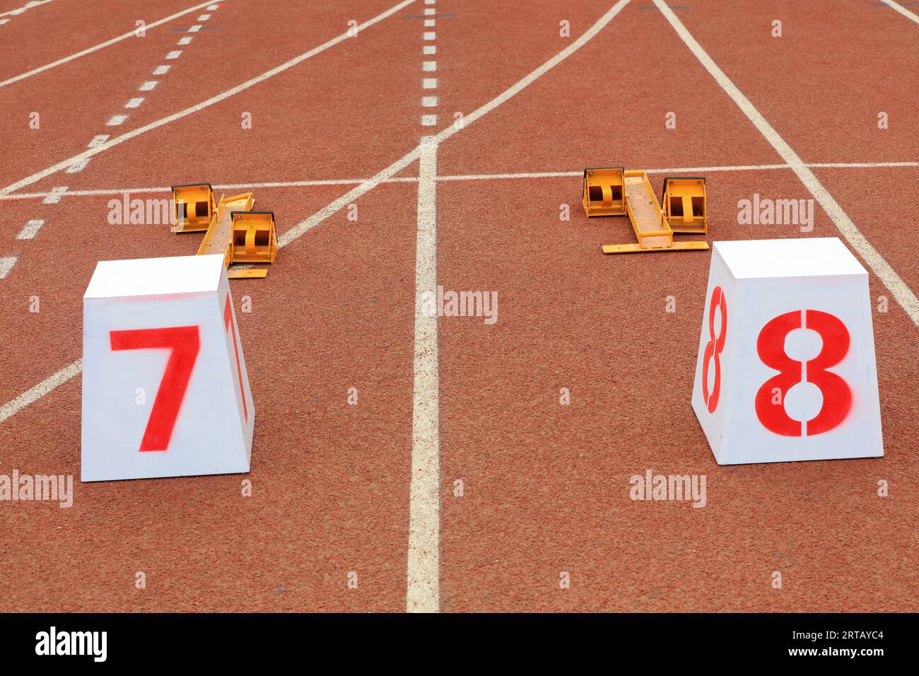 Track numbers and starters on the plastic track on the playground Stock ...
