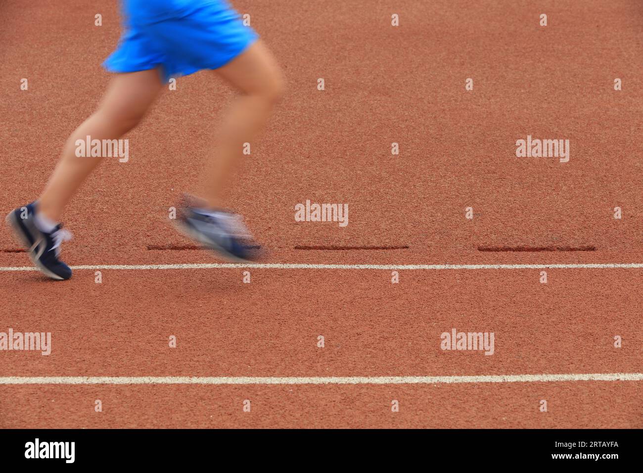 Long distance runners are running on the track Stock Photo - Alamy