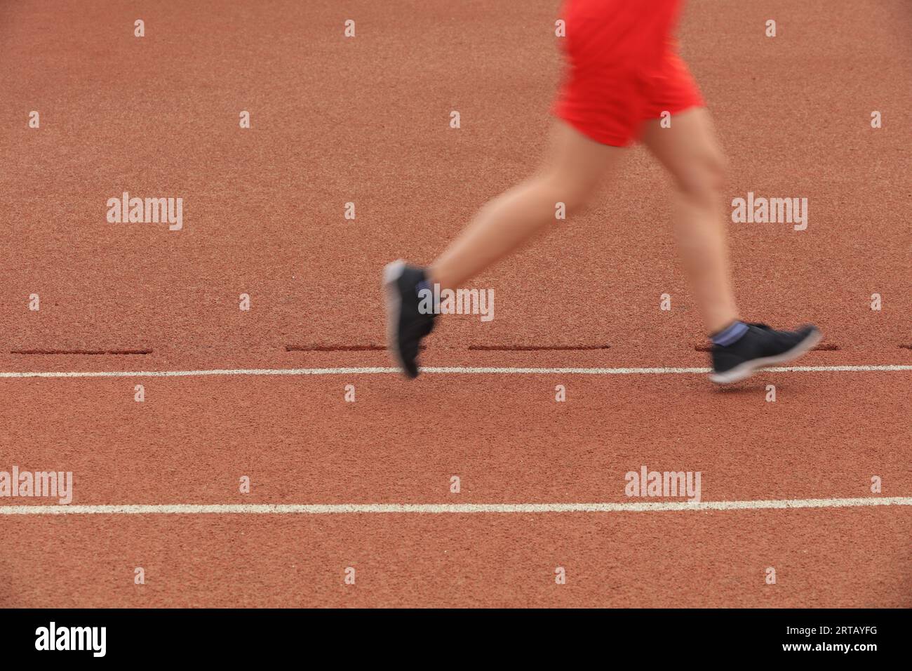 Long distance runners are running on the track Stock Photo - Alamy