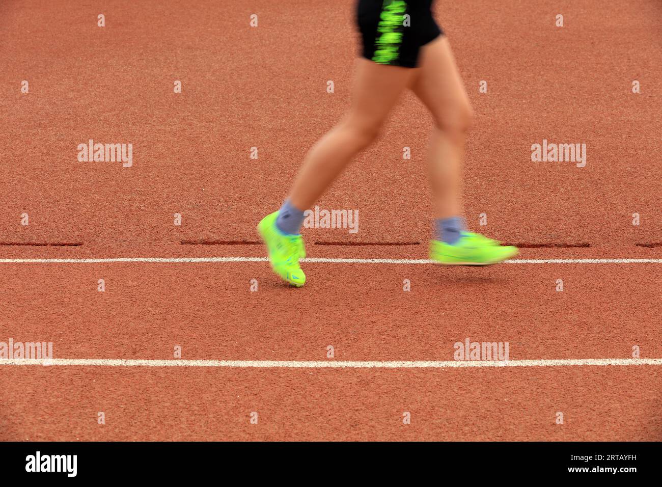 Long distance runners are running on the track Stock Photo - Alamy