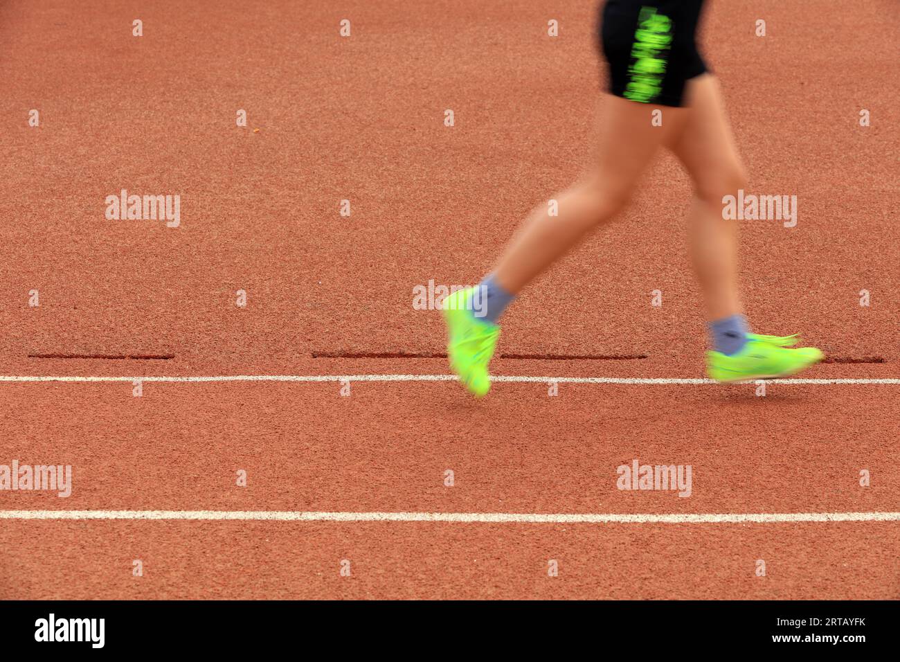 Long distance runners are running on the track Stock Photo - Alamy
