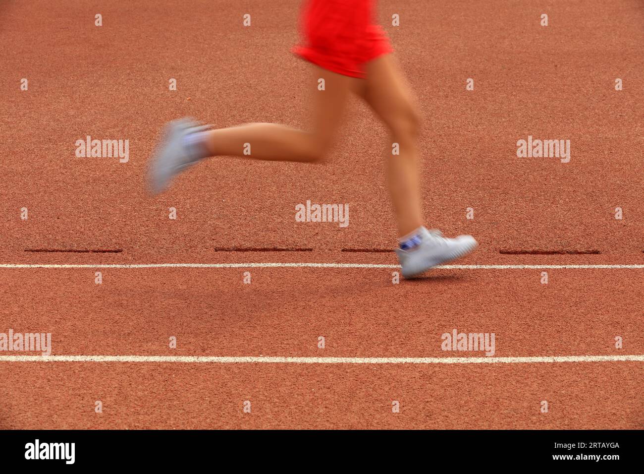 Long distance runners are running on the track Stock Photo - Alamy