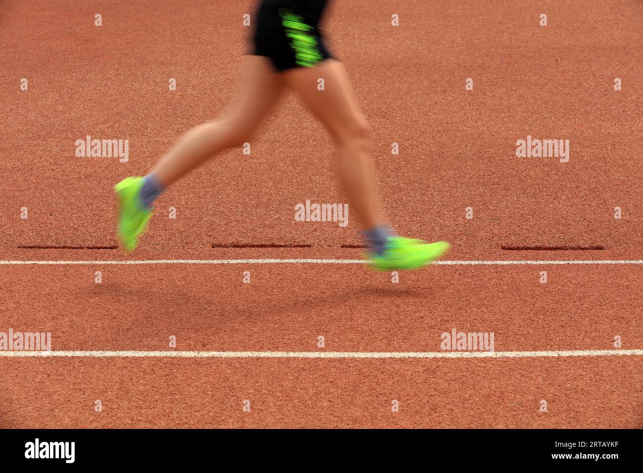 Long distance runners are running on the track Stock Photo - Alamy