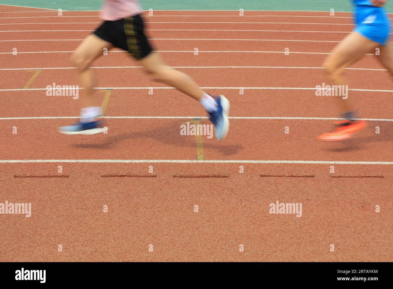 Long distance runners are running on the track Stock Photo - Alamy