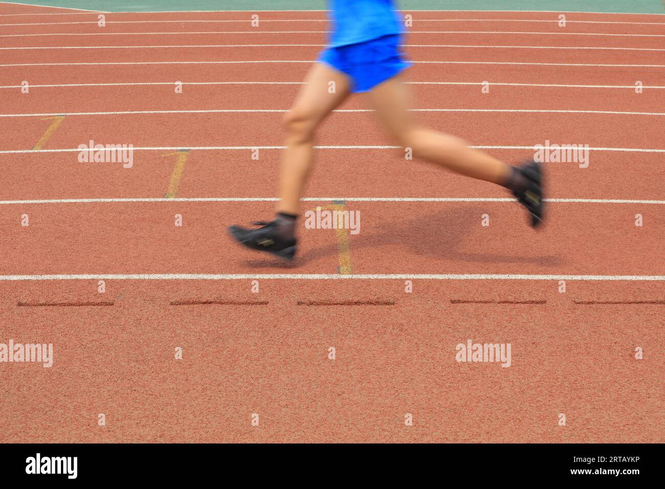 Long distance runners are running on the track Stock Photo - Alamy