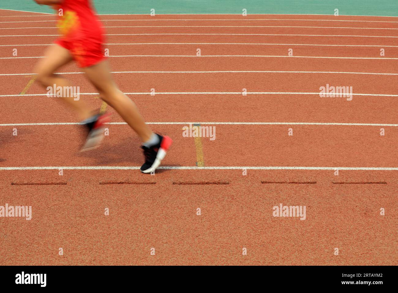 Long distance runners are running on the track Stock Photo - Alamy