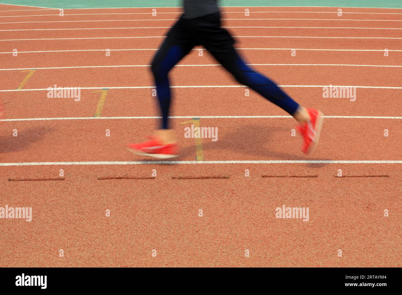 Long distance runners are running on the track Stock Photo - Alamy