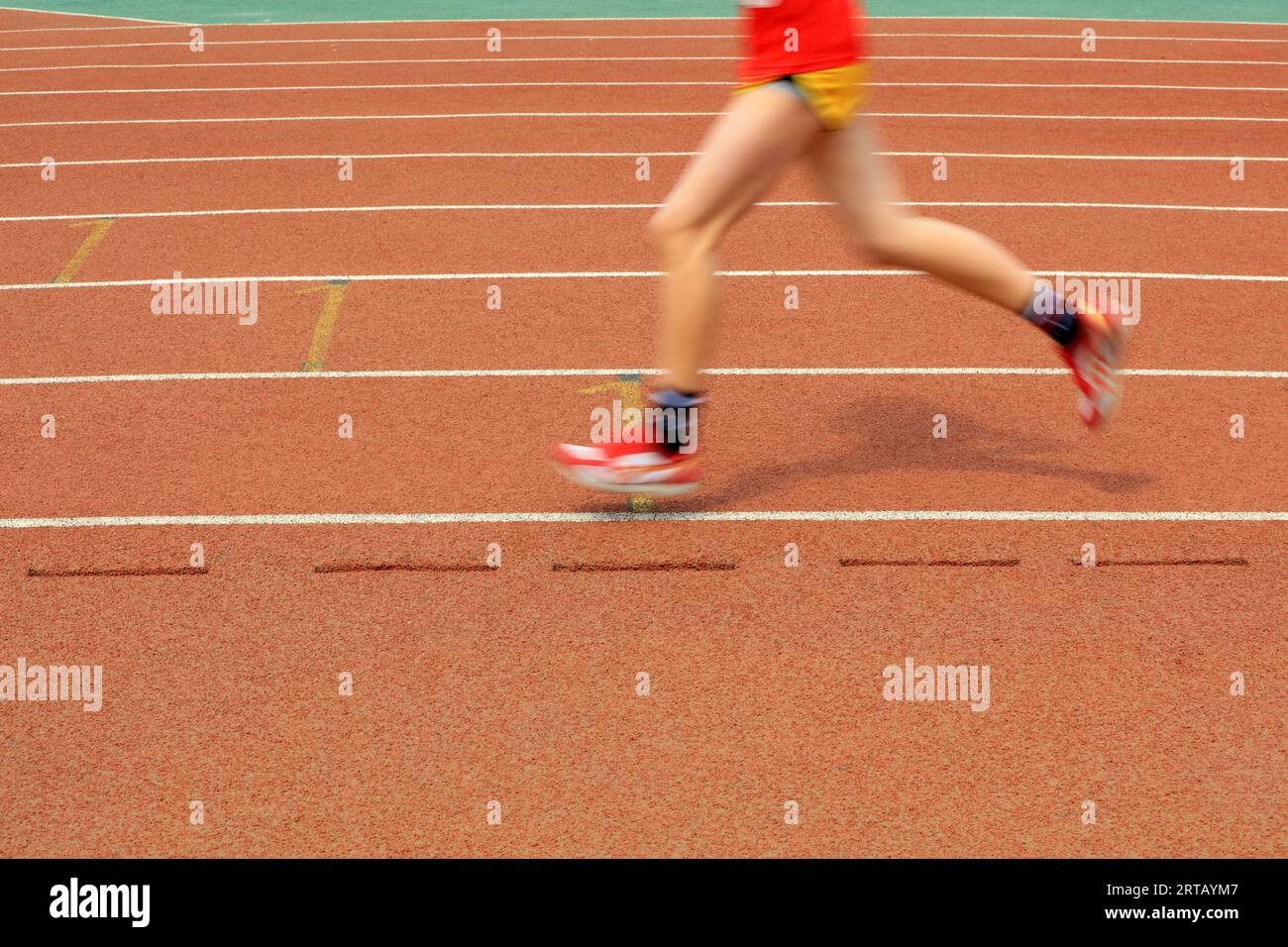 Long distance runners are running on the track Stock Photo - Alamy