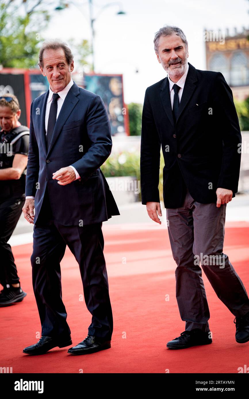 VENICE, ITALY - AUGUST 31: Ramzy Bedia, Xavier Giannoli, Olga Kurylenko ...