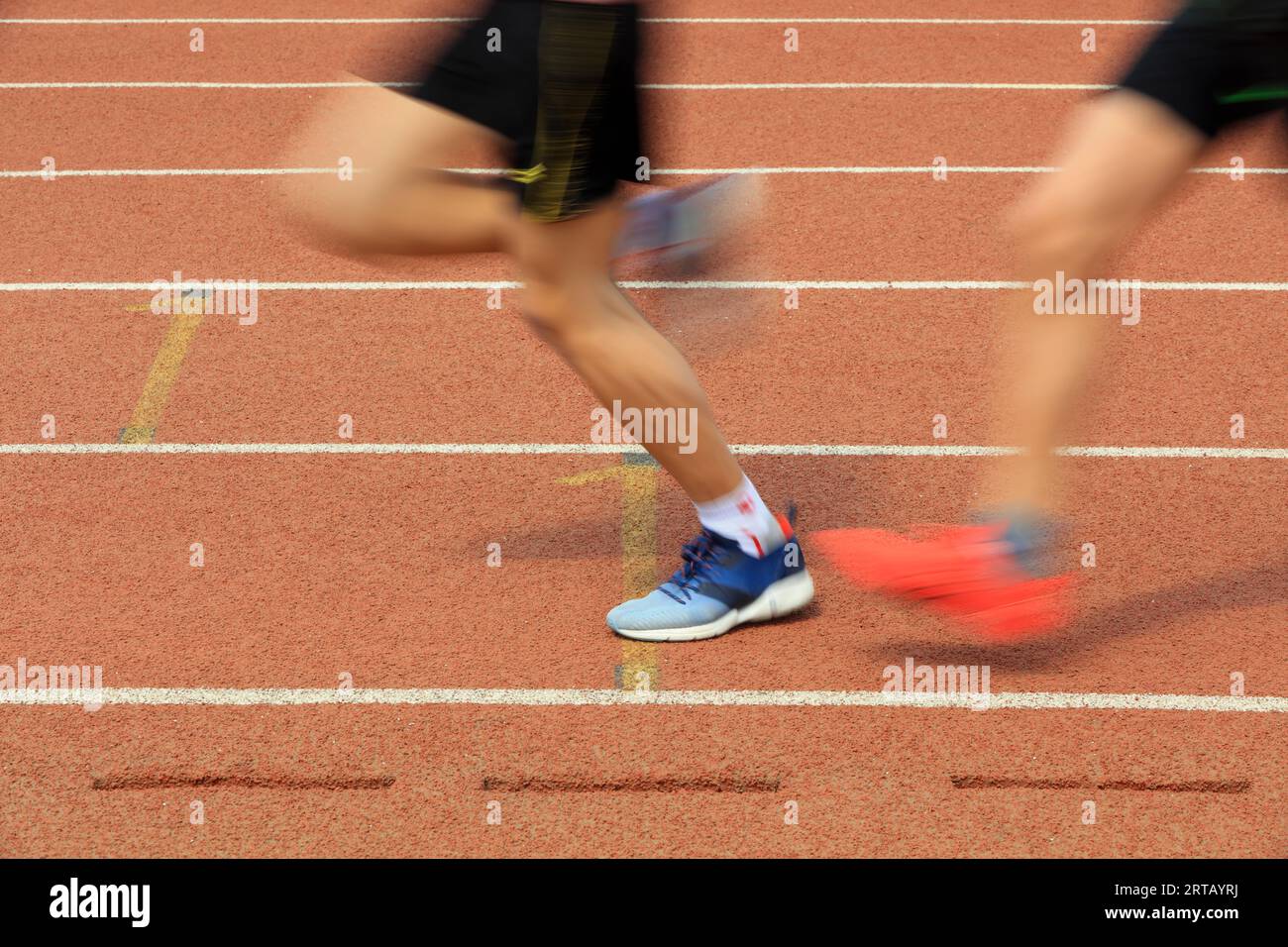 Long distance runners are running on the track Stock Photo - Alamy