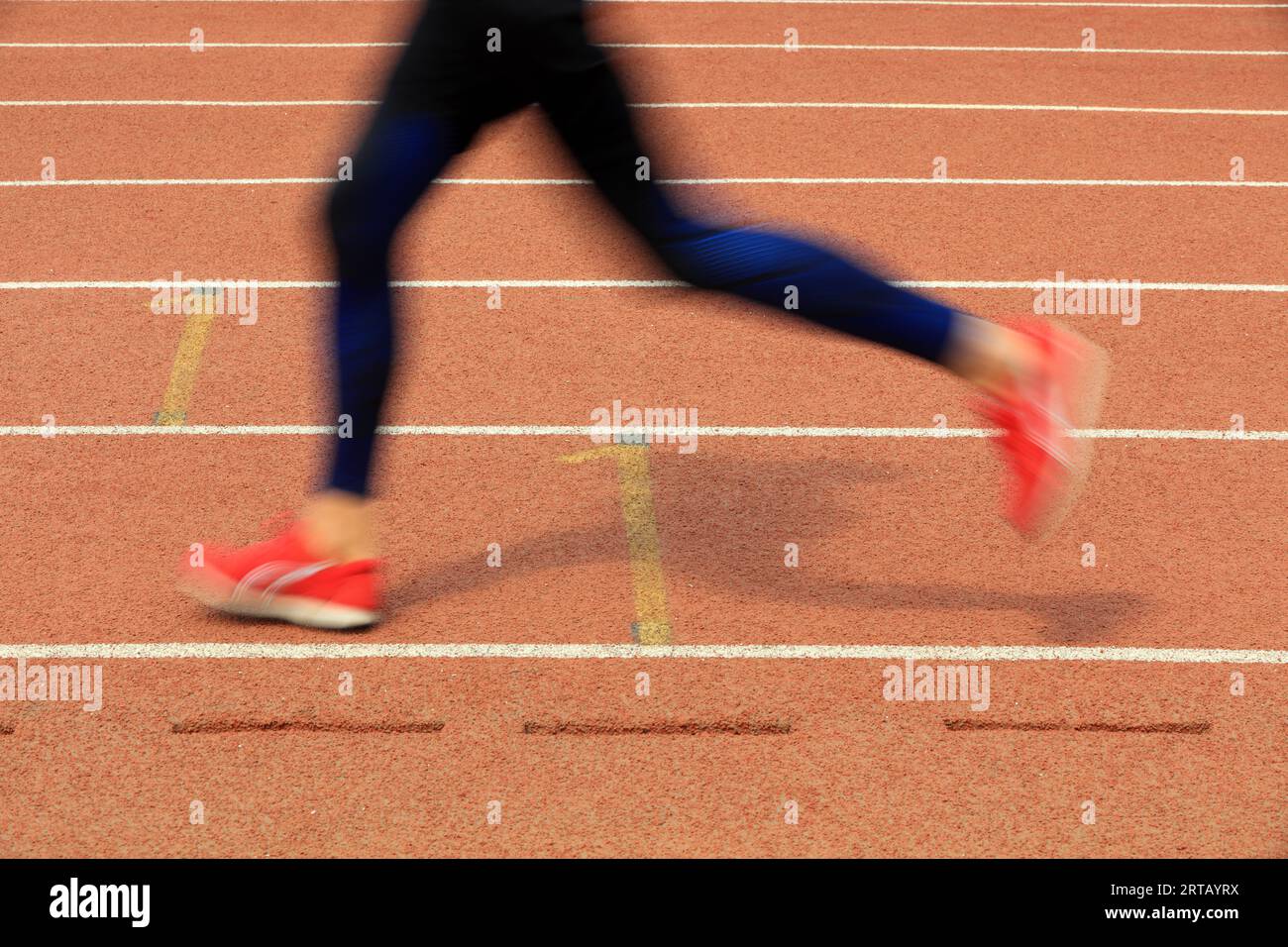 Long distance runners are running on the track Stock Photo - Alamy