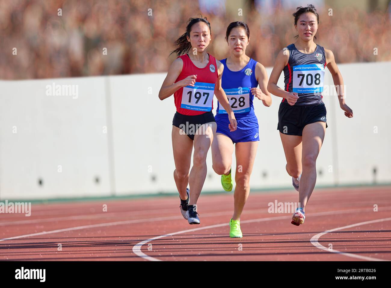 Japanese athletes running on track Stock Photo - Alamy